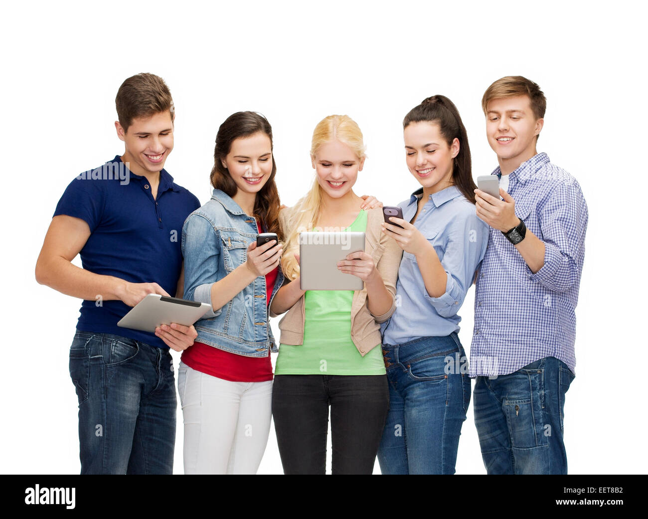 smiling students using smartphones and tablet pc Stock Photo - Alamy