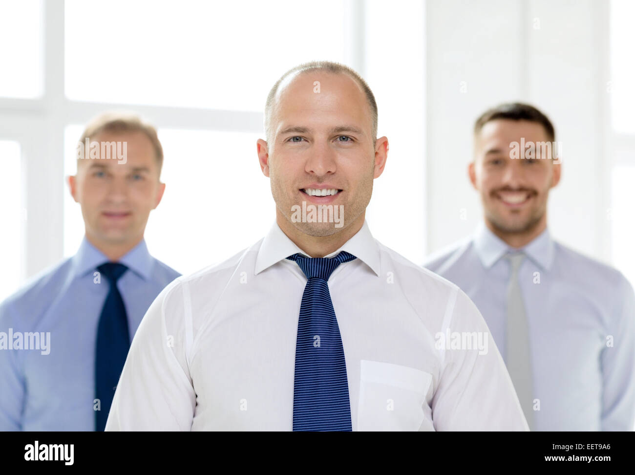 Businessman smiling team hi-res stock photography and images - Alamy