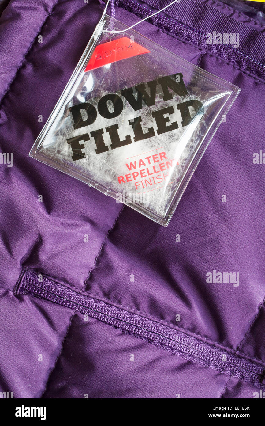 Down Filled Water repellent tag label on purple down jacket Stock Photo ...