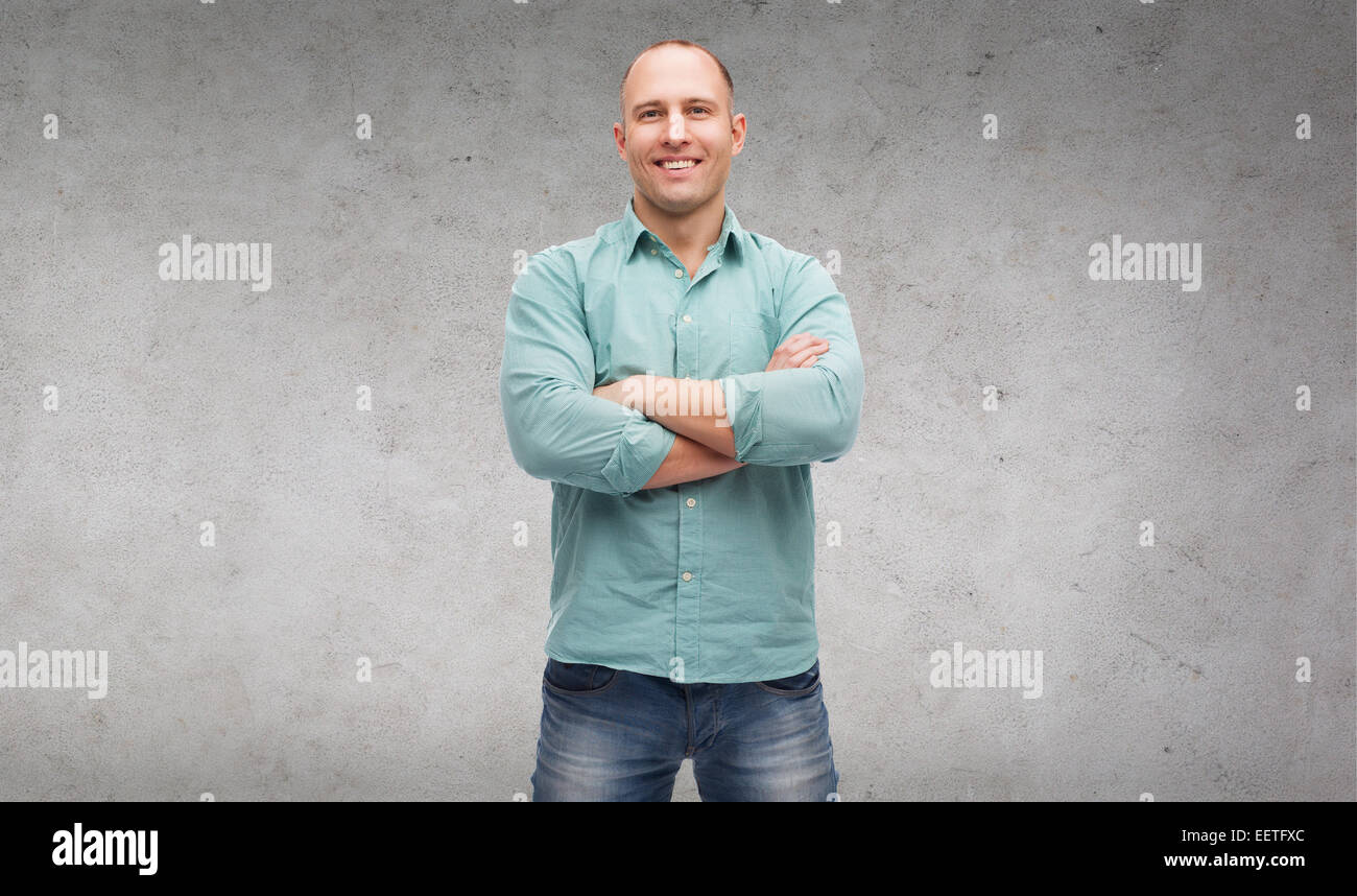 smiling man with crossed arms Stock Photo - Alamy