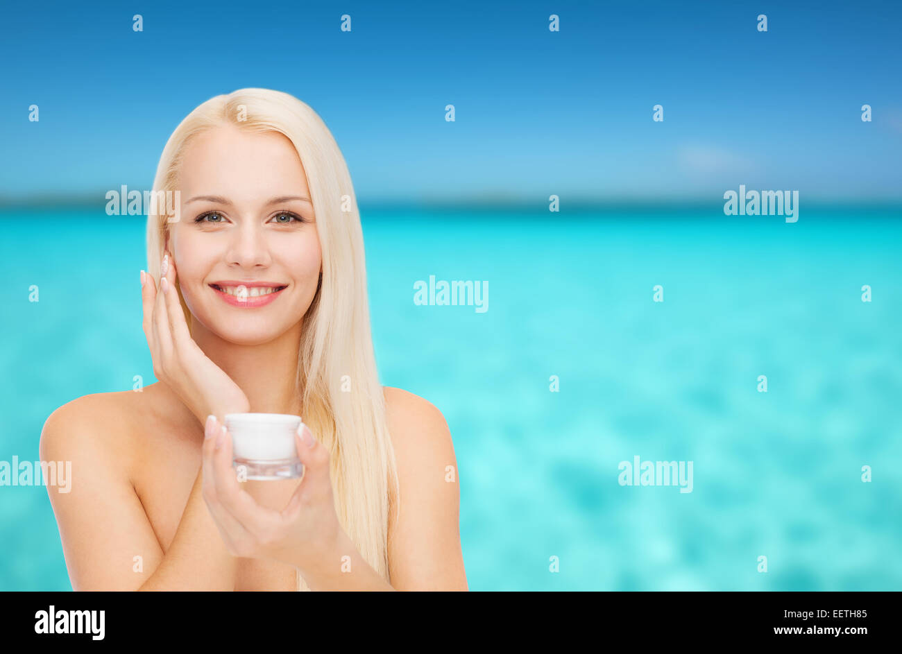 woman applying cream on her skin Stock Photo - Alamy