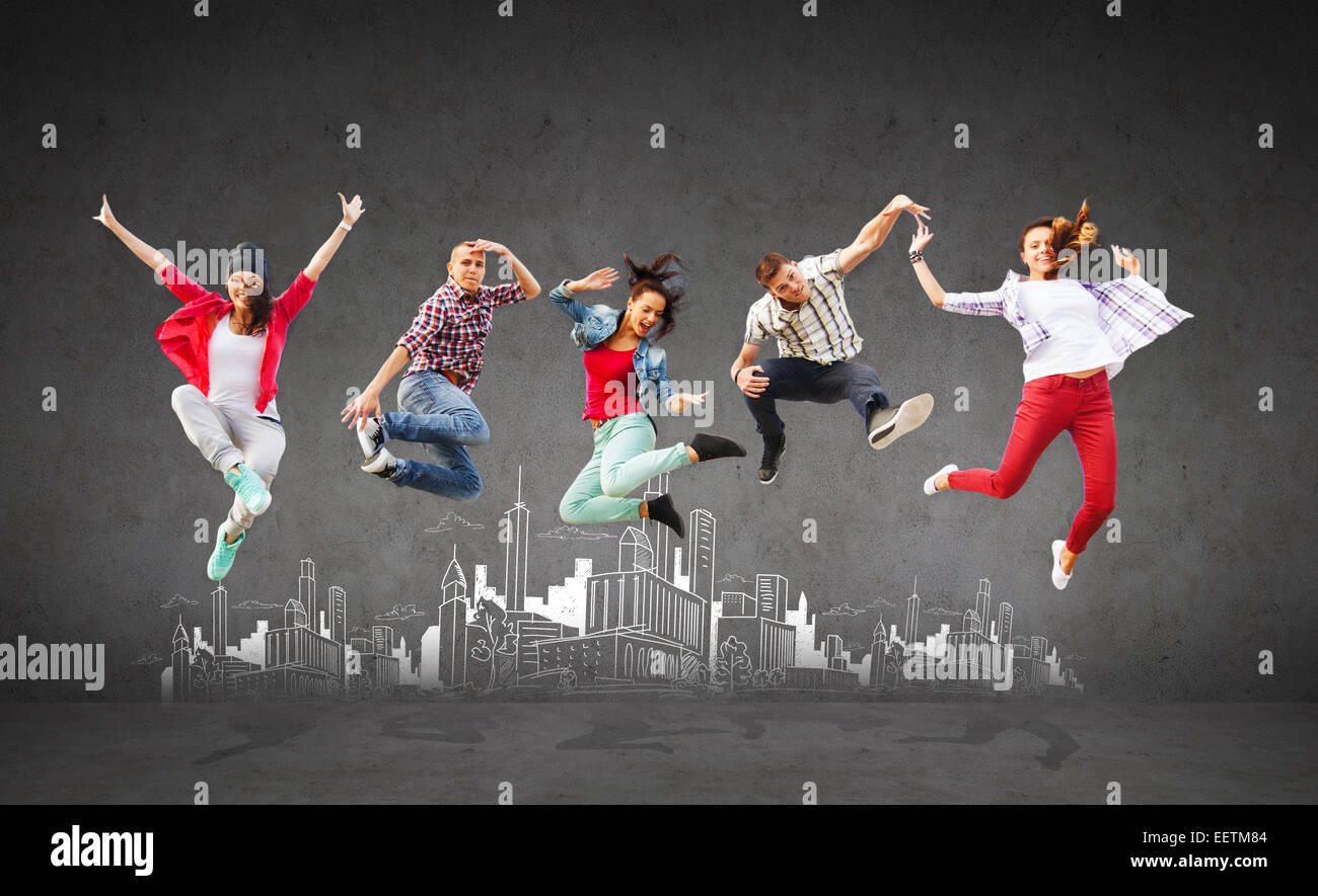 group of teenagers jumping Stock Photo - Alamy
