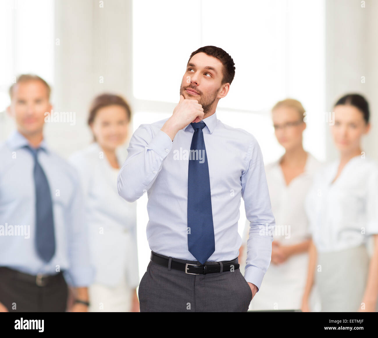handsome businessman looking up Stock Photo - Alamy