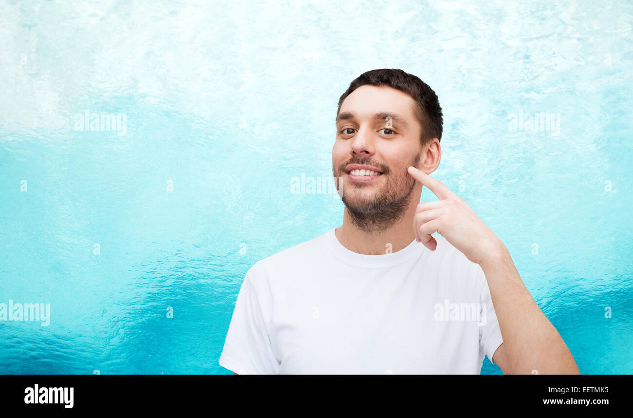 Pointing at cheek hi-res stock photography and images - Alamy