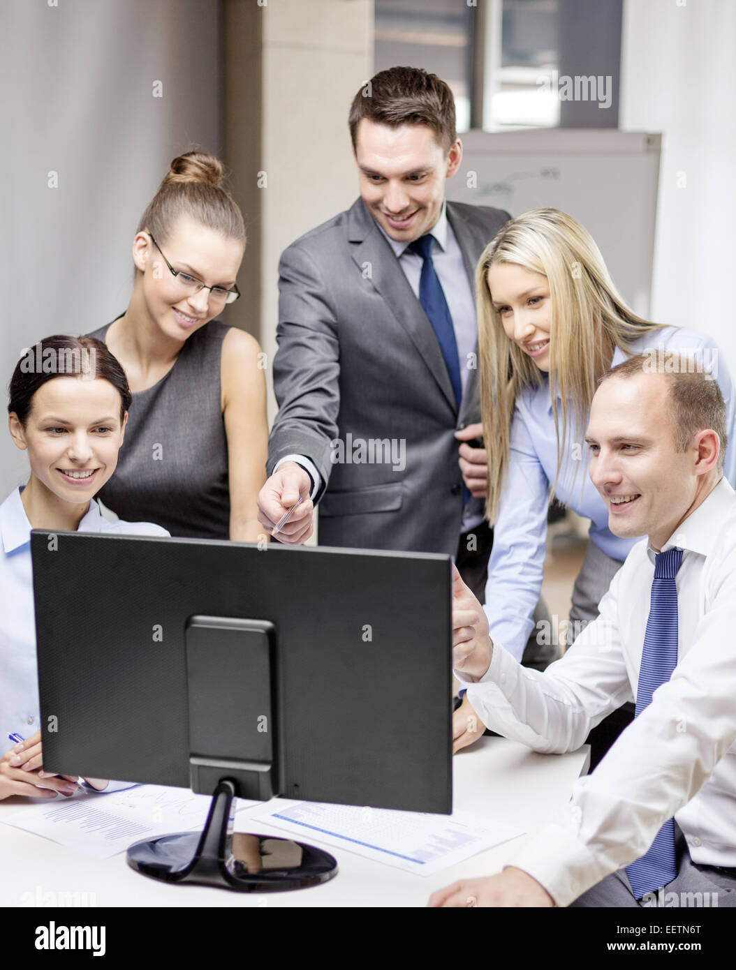 business team with monitor having discussion Stock Photo - Alamy
