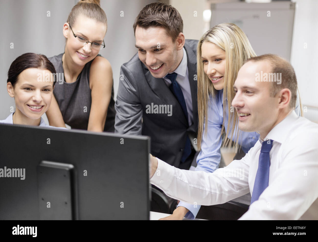 business team with monitor having discussion Stock Photo - Alamy