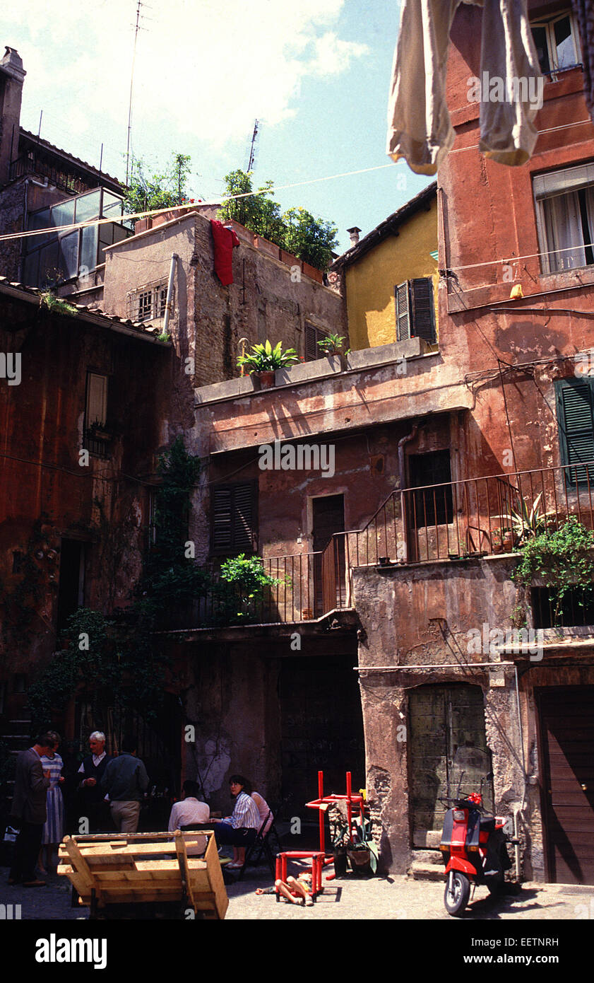 Italian family in a private courtyard in Rome Italy Stock Photo - Alamy