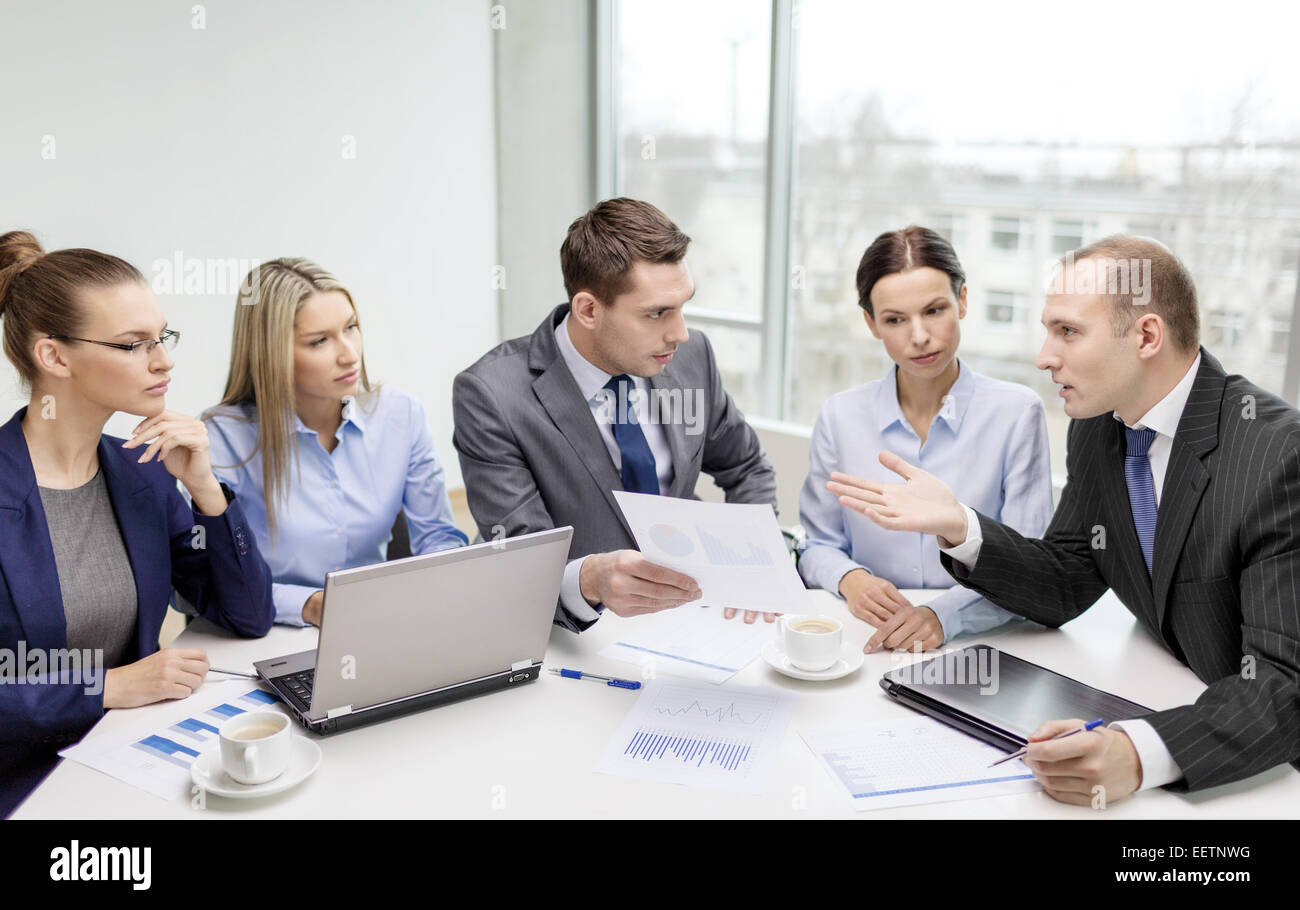 business team with laptop having discussion Stock Photo - Alamy