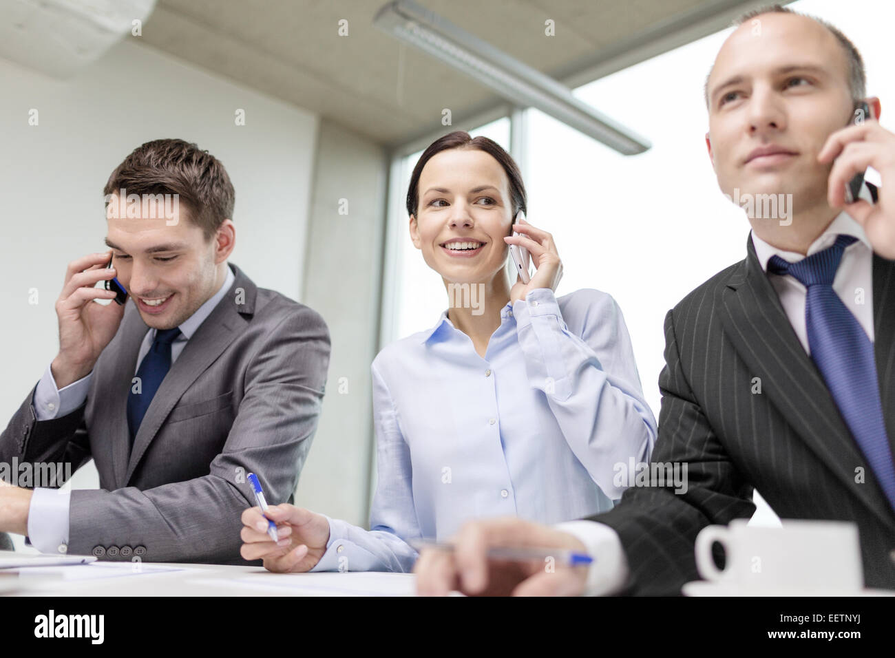 business team with smartphones having conversation Stock Photo - Alamy