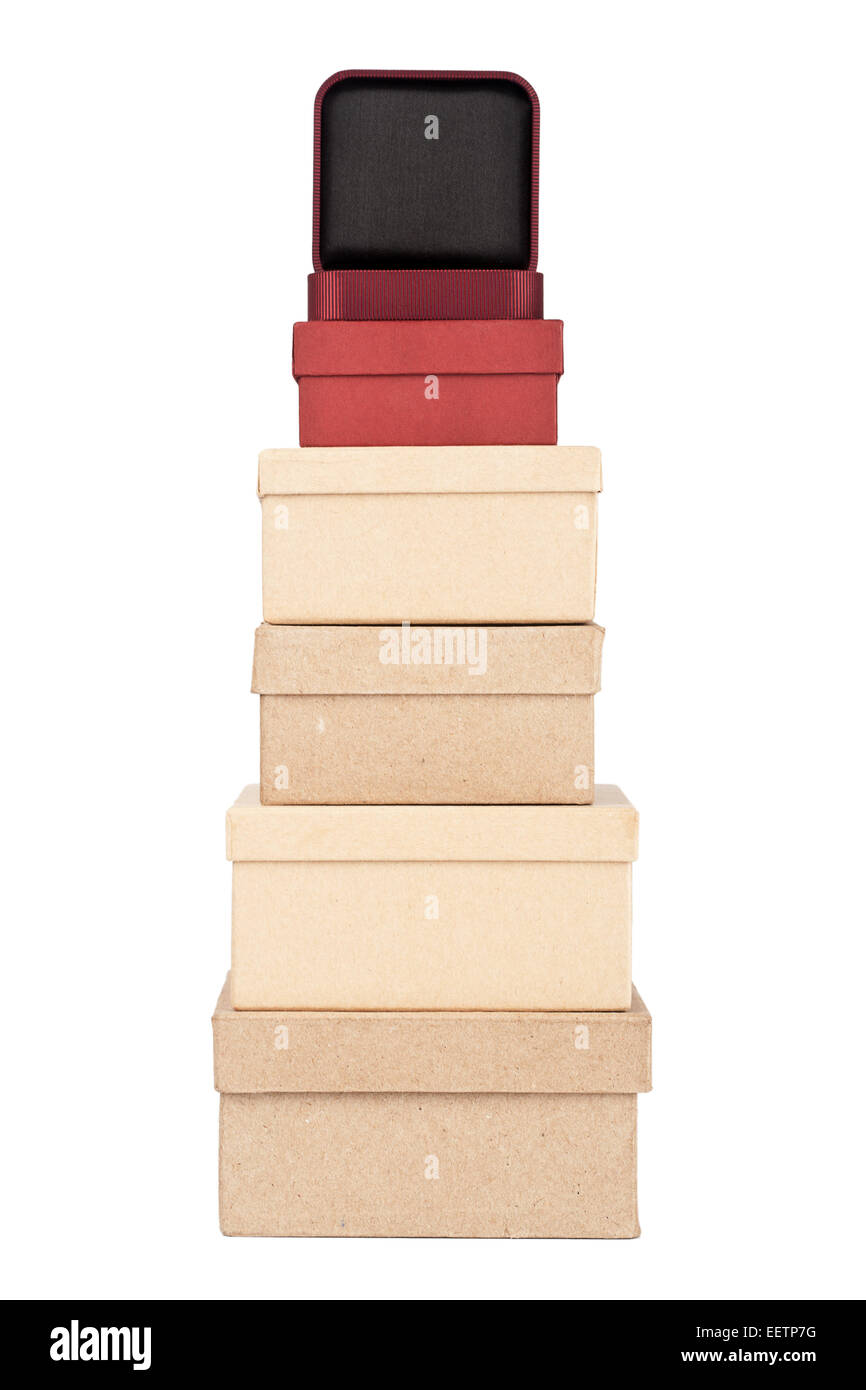 Tower made from cardboard boxes with a jewelry box on top isolated on a ...