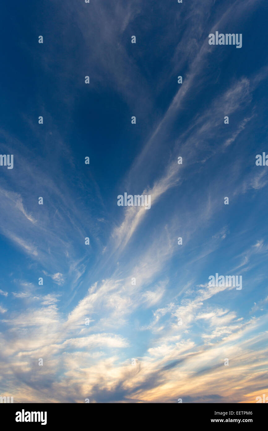 Fine white wispy clouds in sky at sunset over Gulf of Mexico at ...