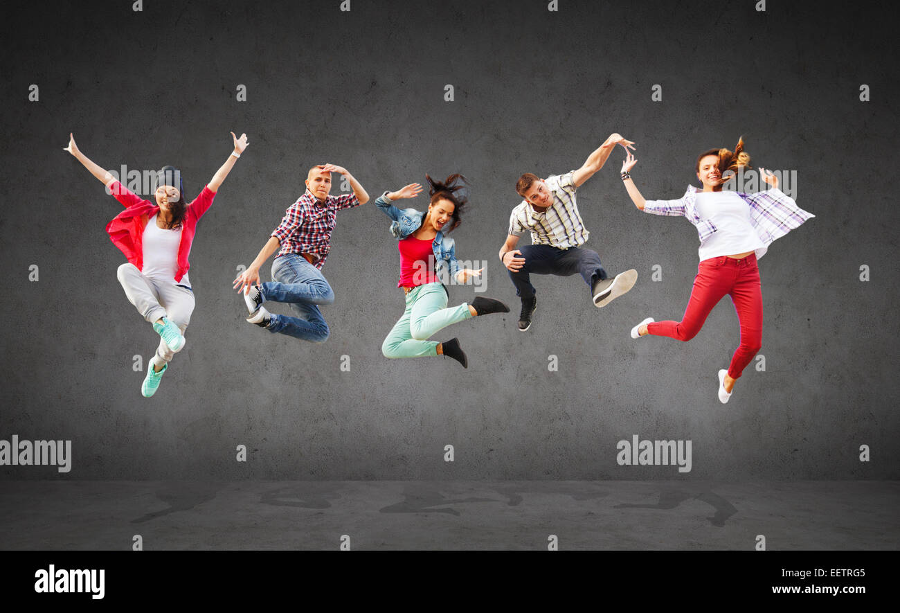 group of teenagers jumping Stock Photo - Alamy