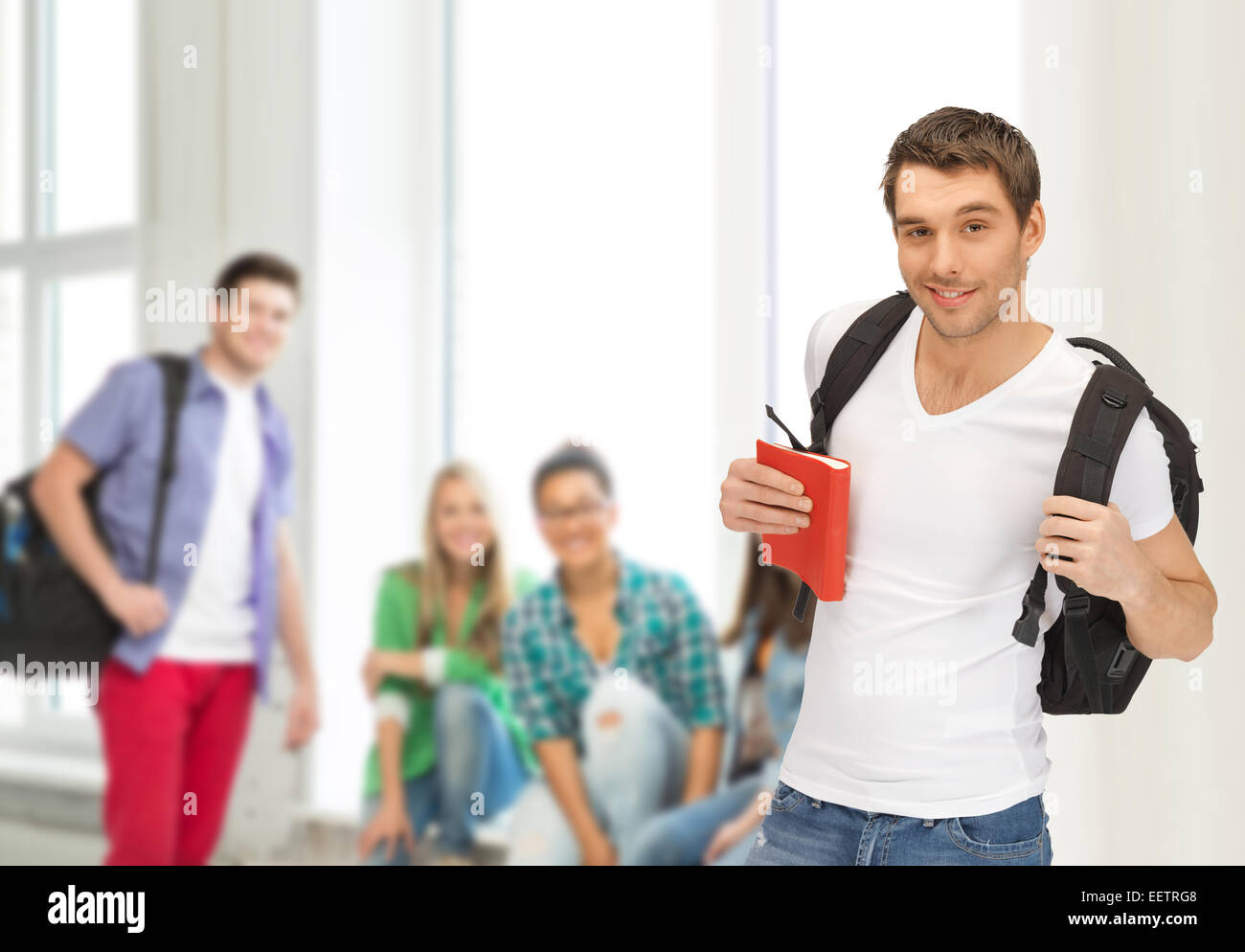 travelling student with backpack and book Stock Photo - Alamy