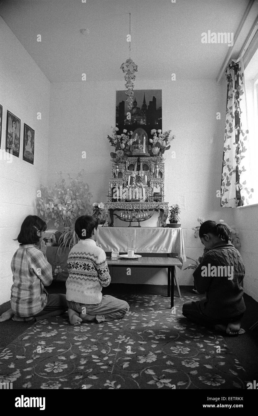 Three Asian children praying Hindu altar Stock Photo - Alamy