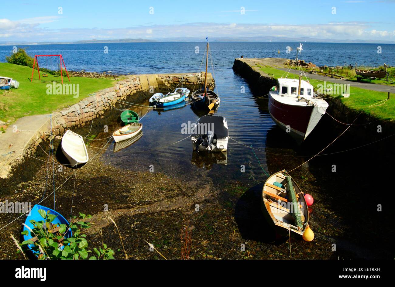 Boats in a harbour at Corrie on the Isle of Arran, Scotland Stock Photo ...