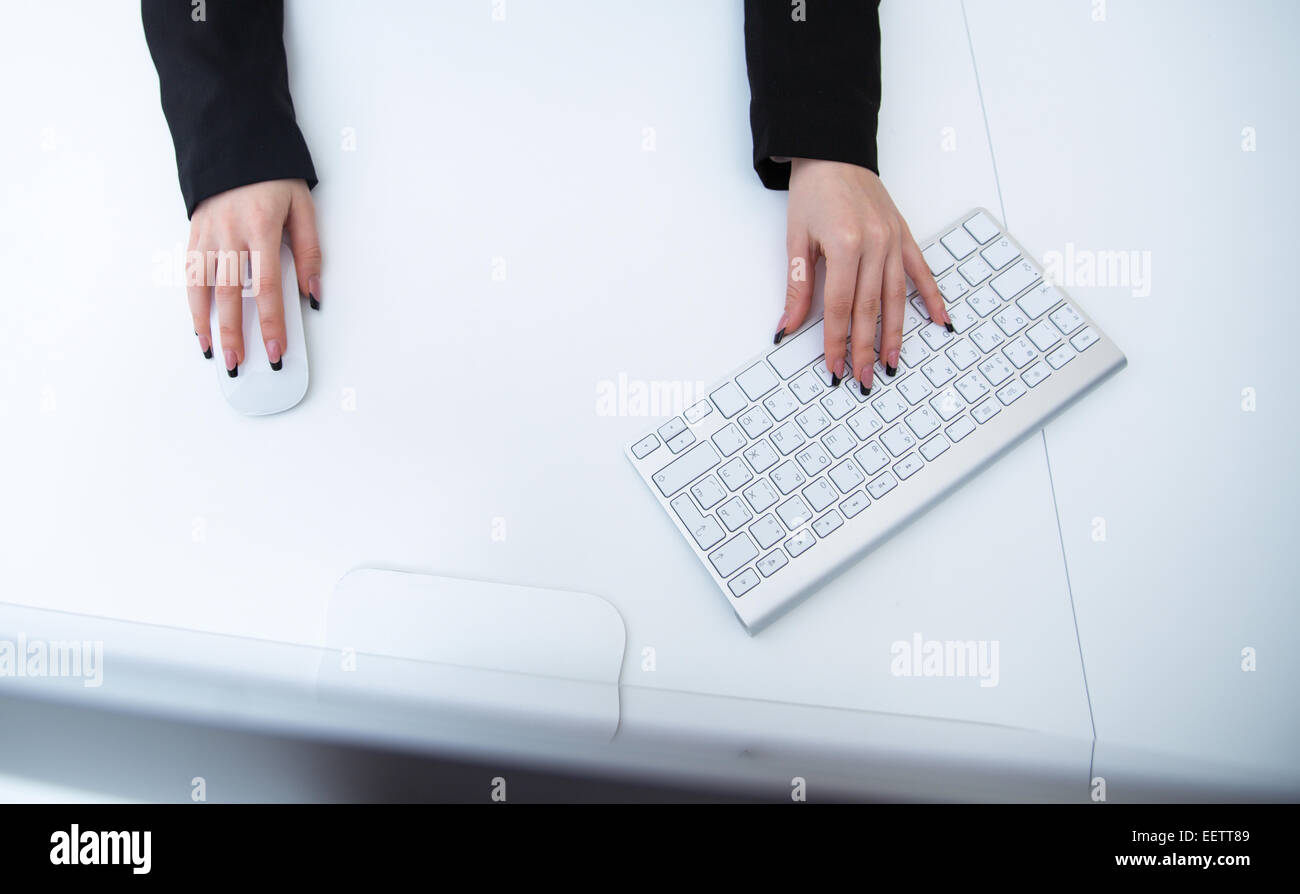 Closeup image of female hands with computer mouse and keyboard Stock ...
