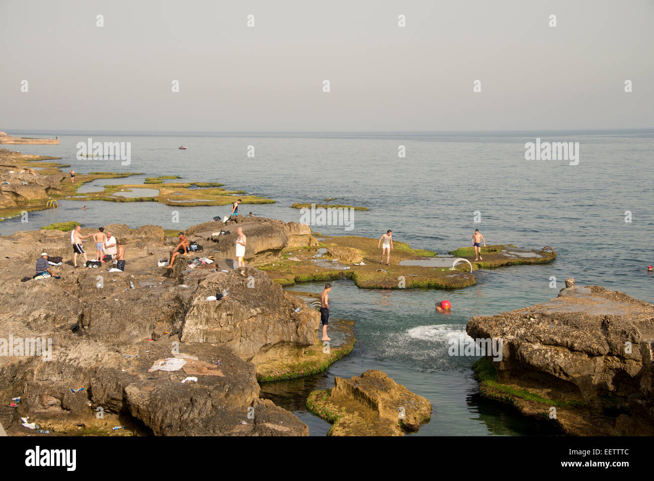 People sunbathing on rocks, Beirut, Lebanon Stock Photo - Alamy