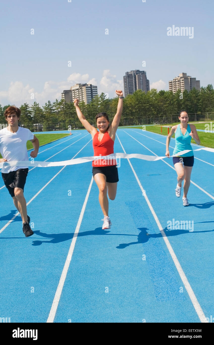 Athletes running towards finish line hi-res stock photography and ...