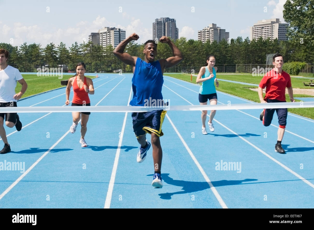 Athletes running towards finish line hi-res stock photography and ...