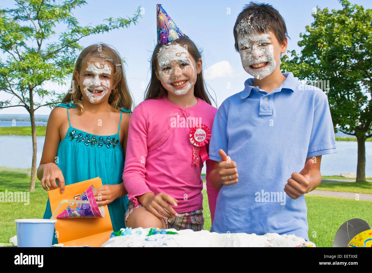 Children eating birthday cake hands hi-res stock photography and images ...