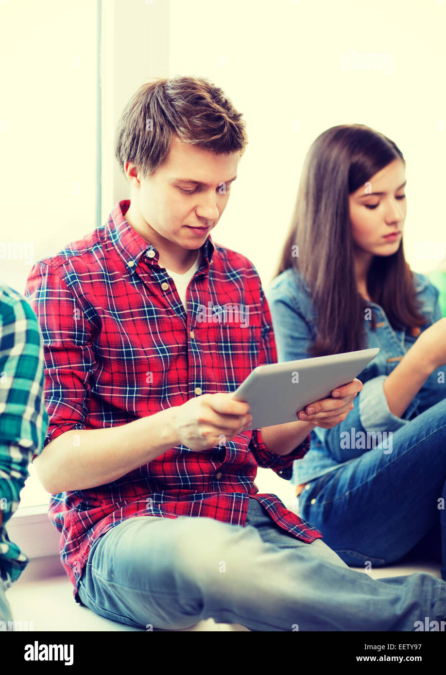 student looking into tablet pc at school Stock Photo - Alamy