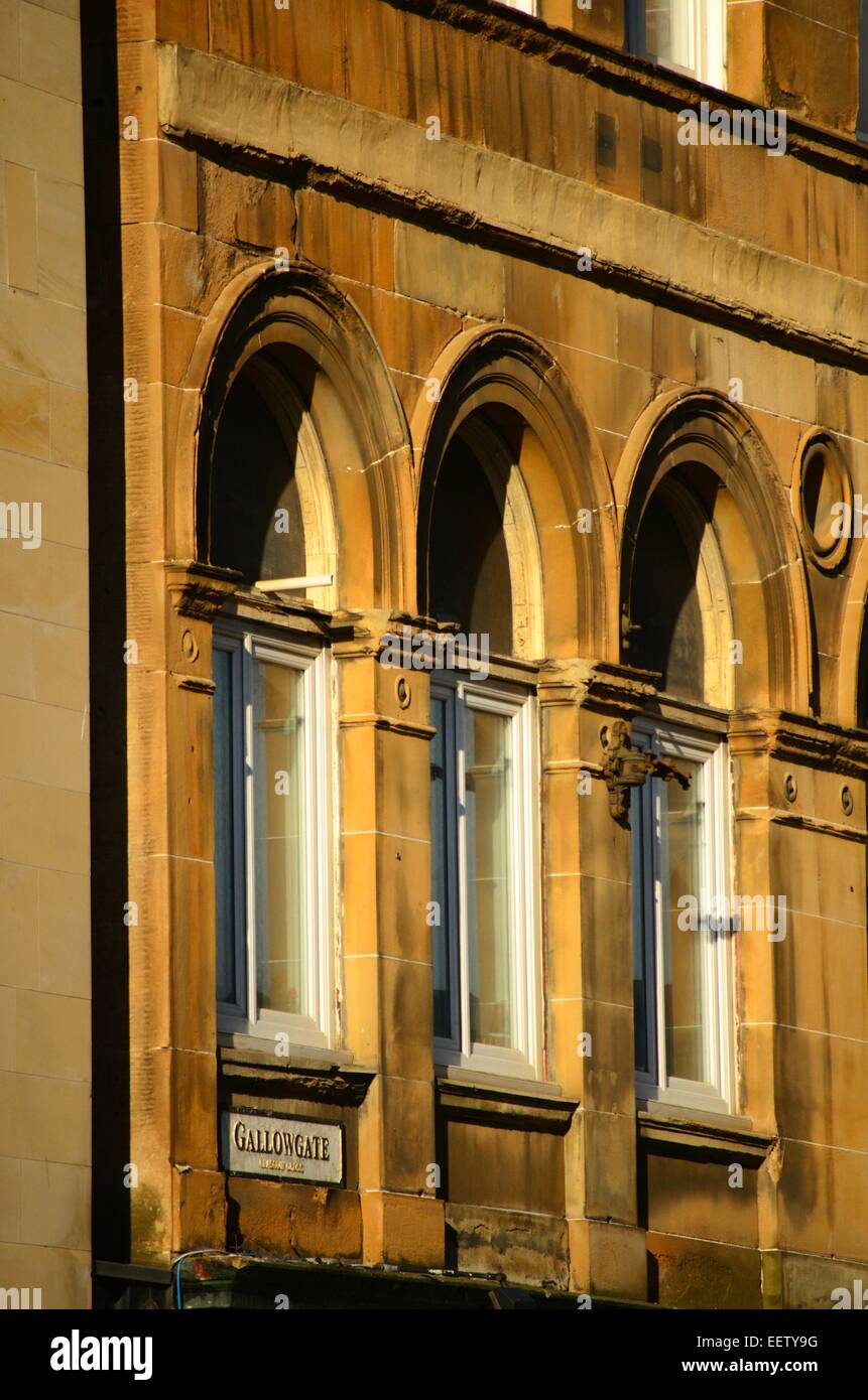 Windows on a sandstone building on the Gallowgate at Glasgow Cross in ...