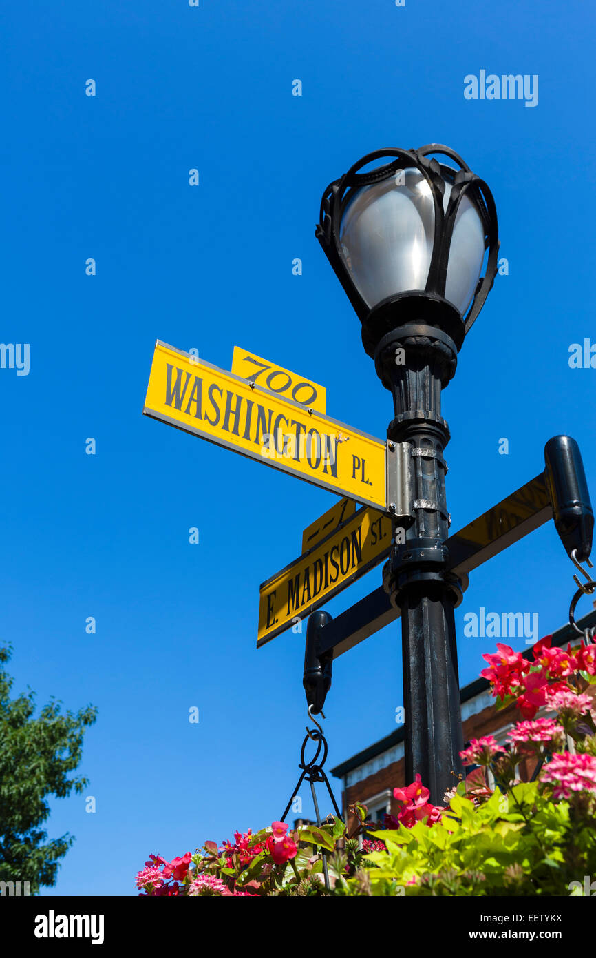 Street sign for Washington Place and E Madison St in the Mount Vernon ...