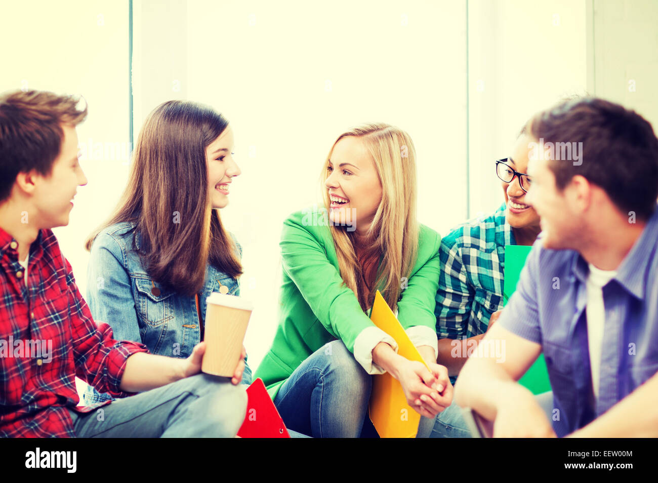 students communicating and laughing at school Stock Photo - Alamy