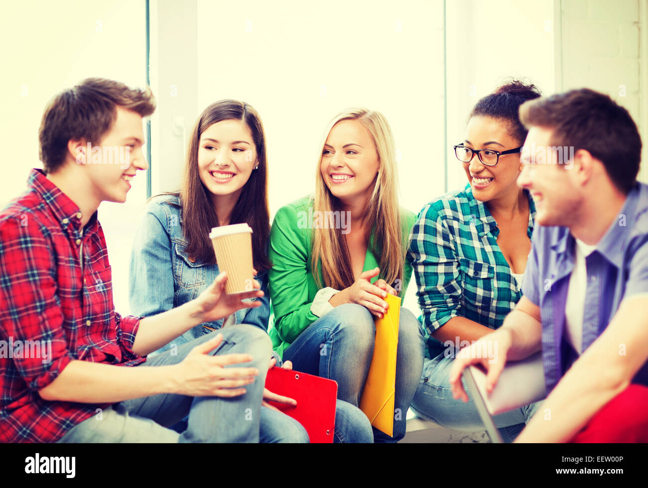 students communicating and laughing at school Stock Photo - Alamy