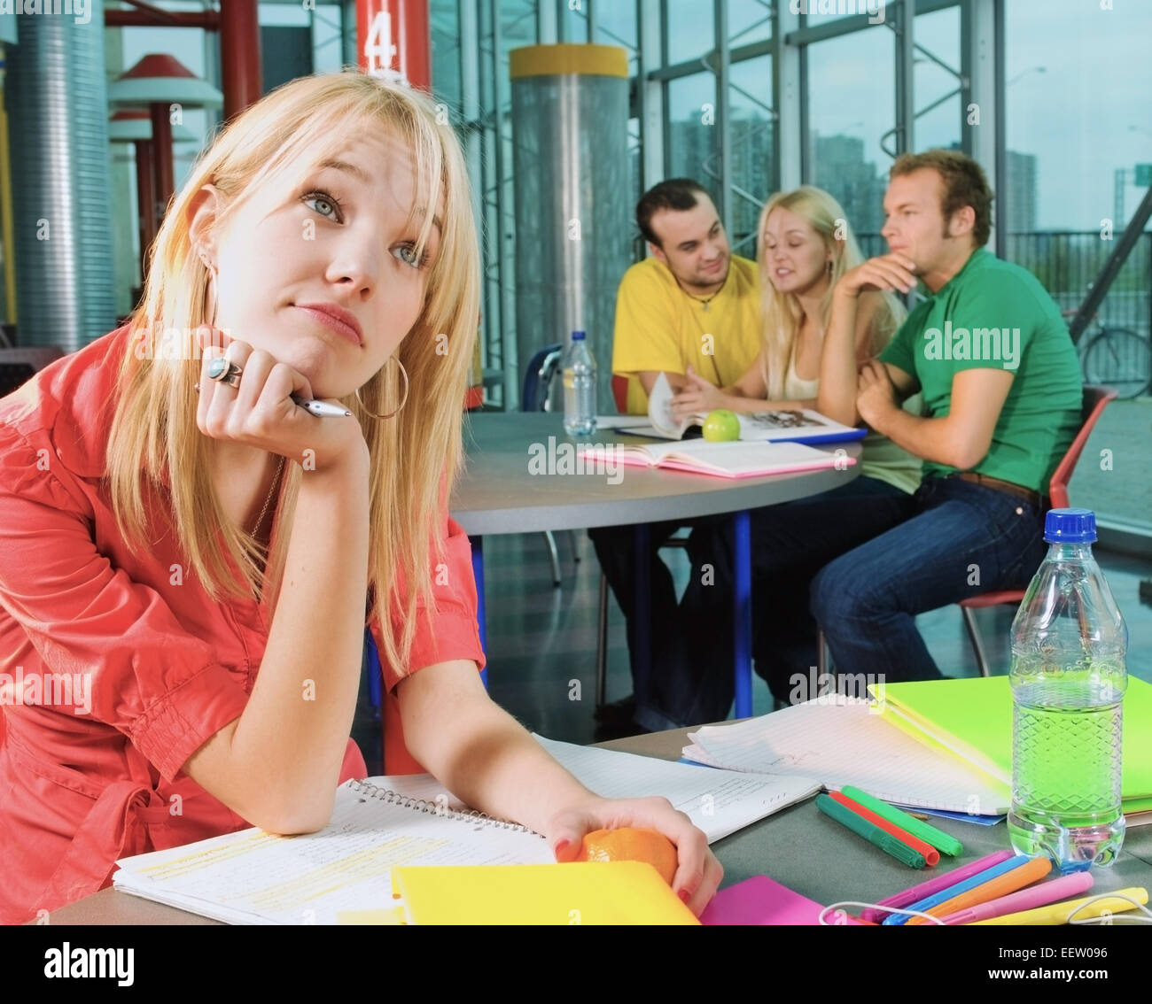 Female college student working on assignment Stock Photo - Alamy