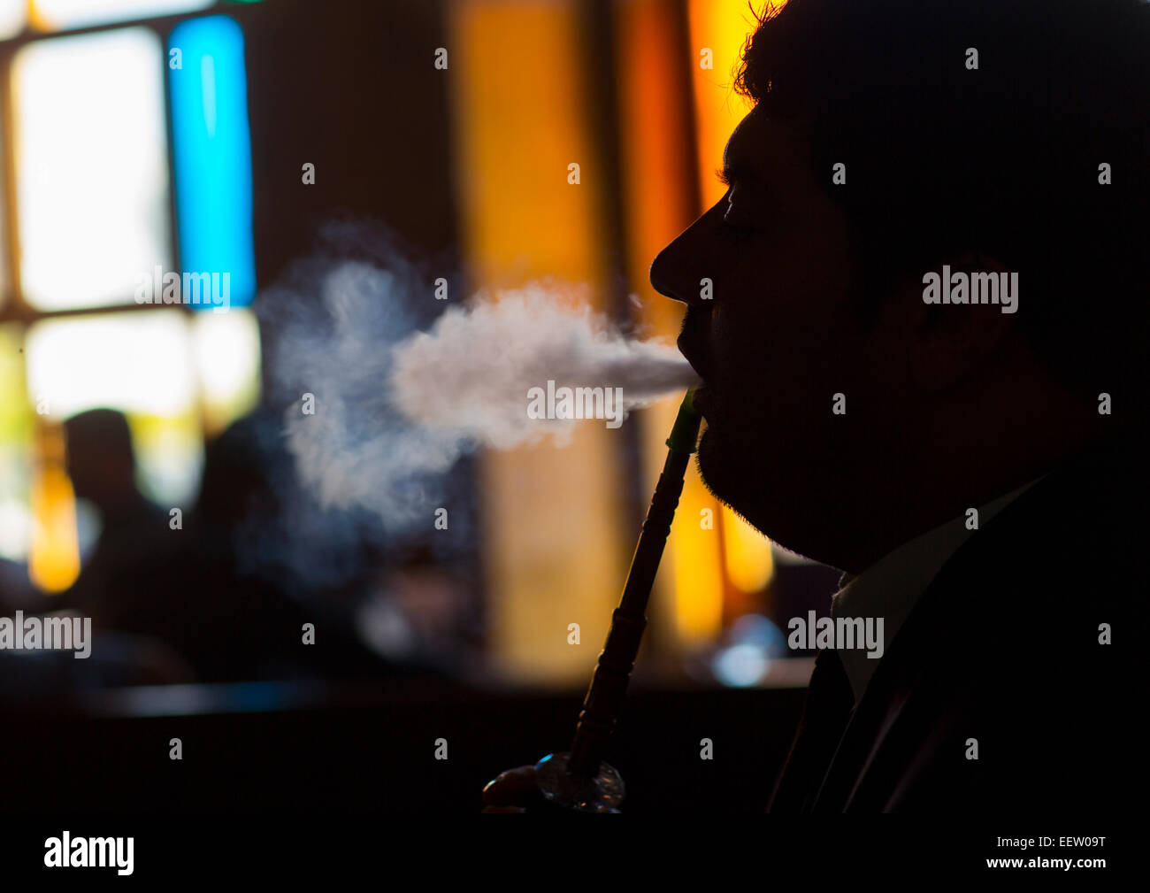 Man smoking out window in hi-res stock photography and images - Alamy