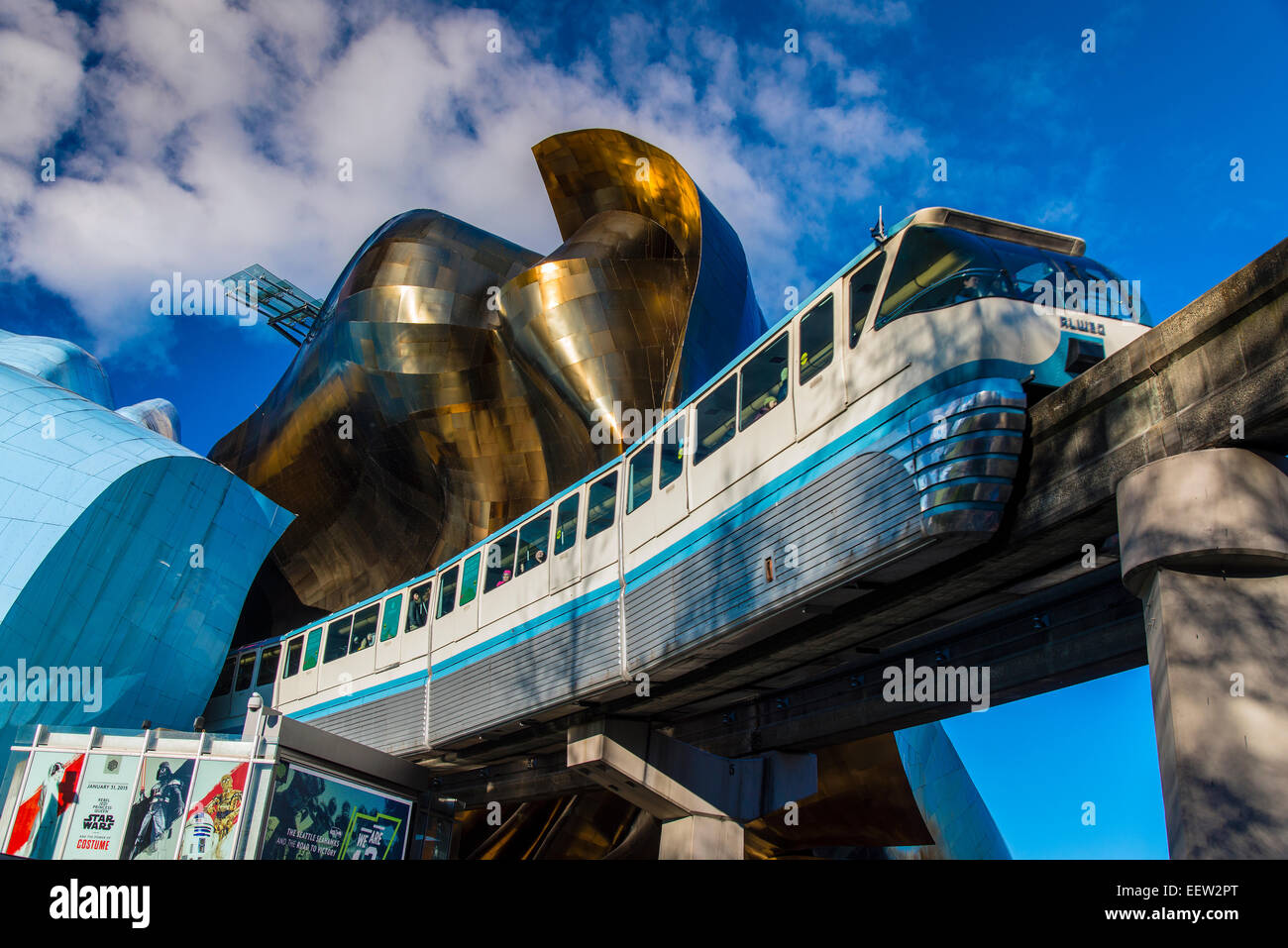 Seattle Center Monorail passing through the Experience Music Project ...