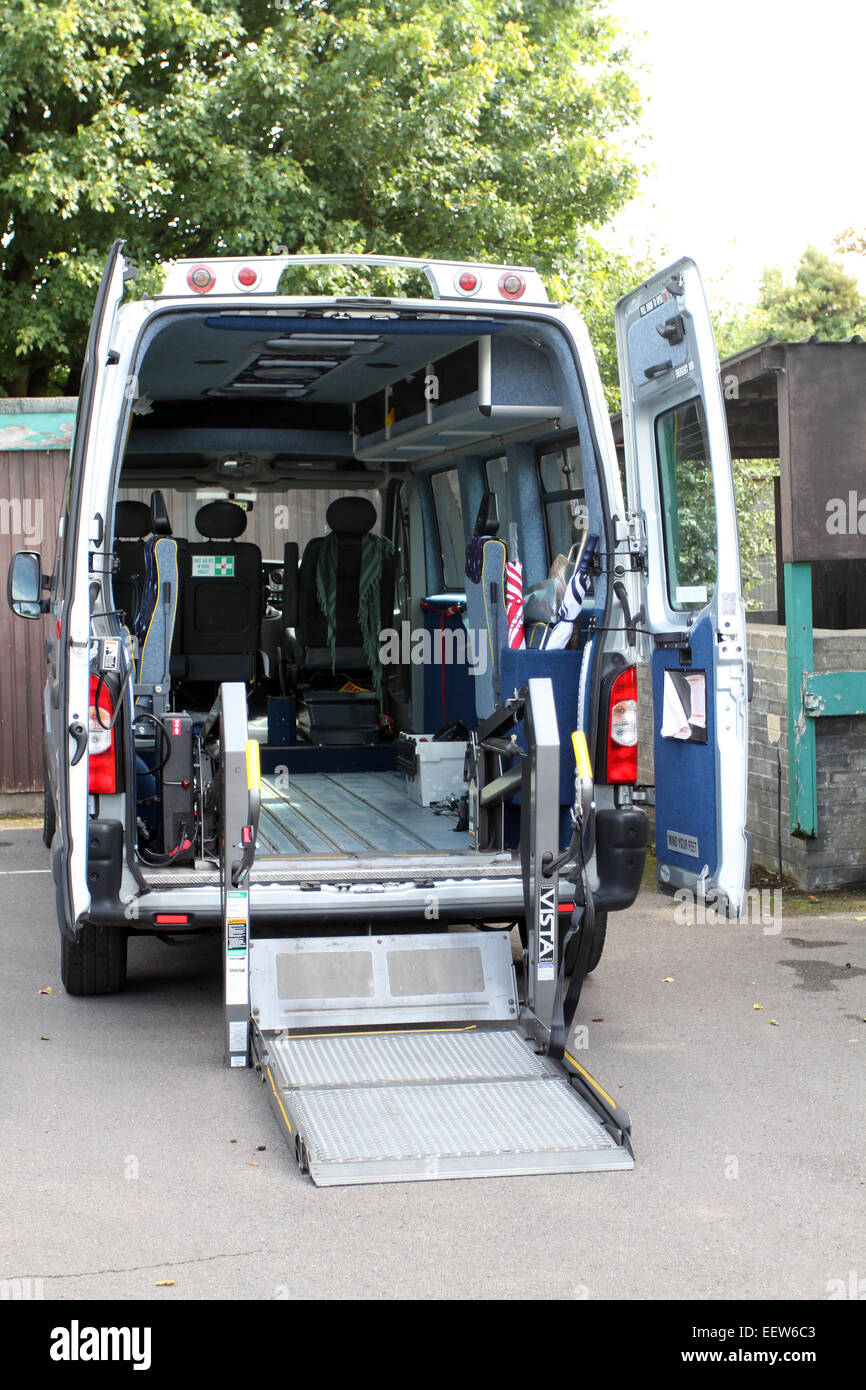 Open rear doors to a van converted into an ambulance for the disabled ...