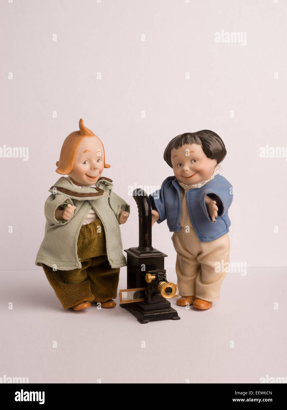Antique dolls of Max and Moritz with toy magic lantern Stock Photo - Alamy