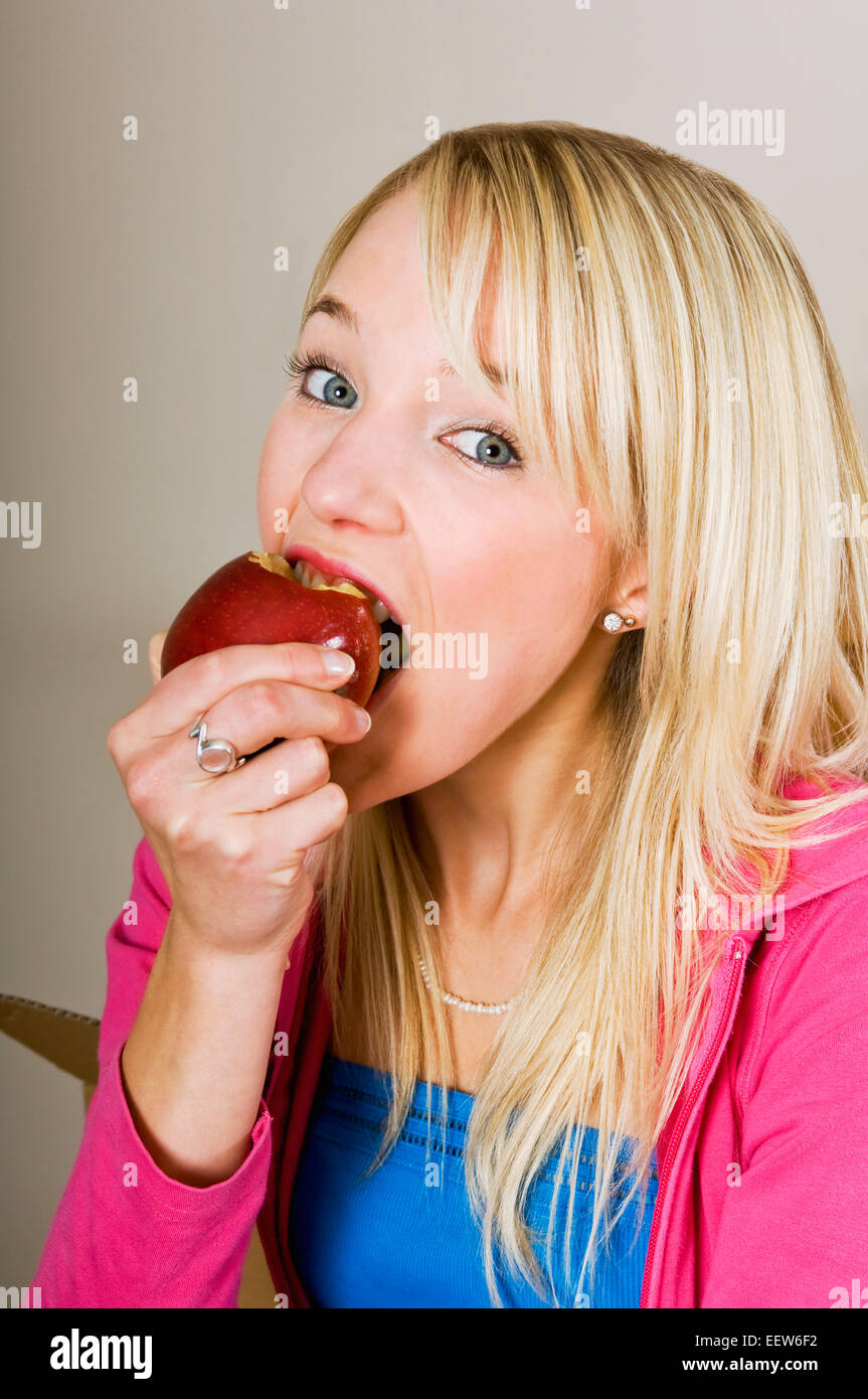Young woman apple fruit eye contact hi-res stock photography and images ...