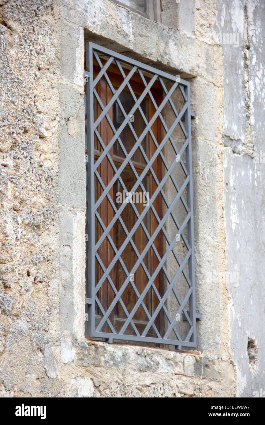 Rustic window with grates close up view Stock Photo - Alamy