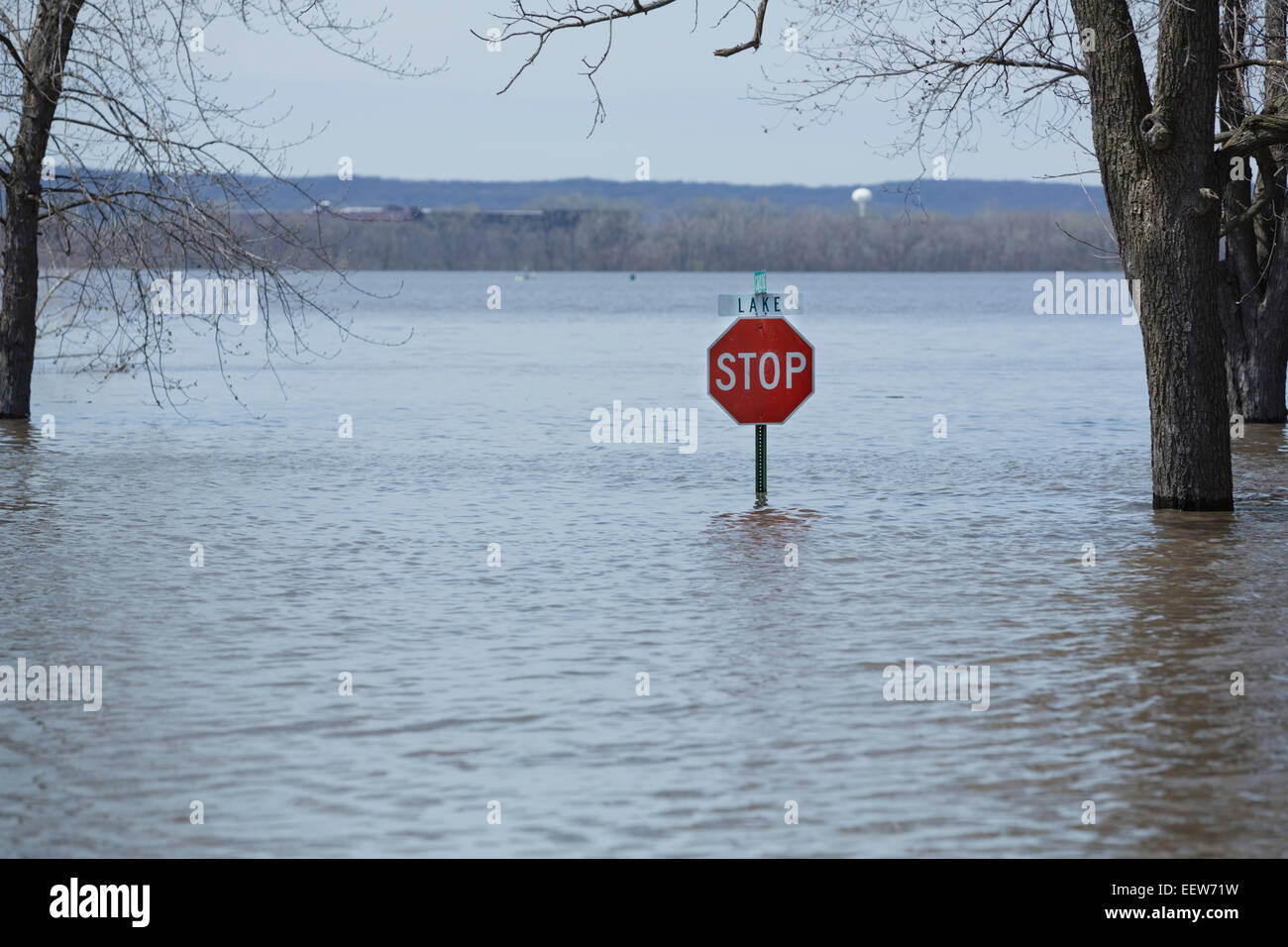 Stop sign sticking out from flood waters Stock Photo - Alamy