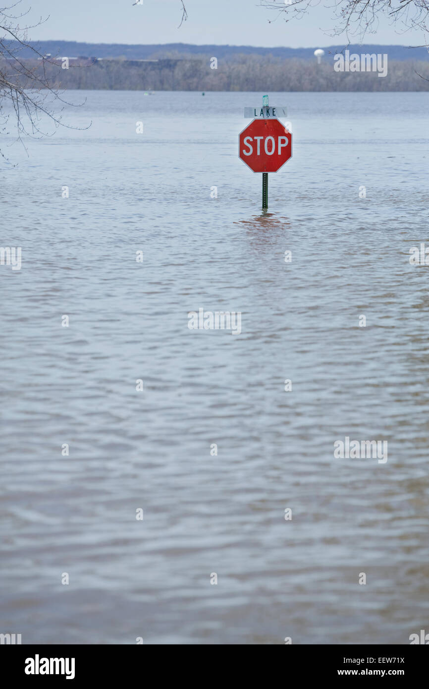 Stop sign sticking out from flood waters Stock Photo - Alamy