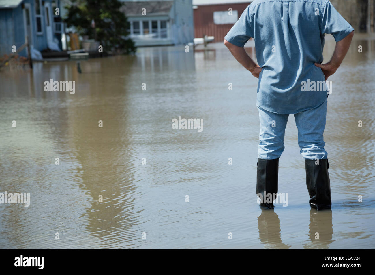 Flood man water wading hi-res stock photography and images - Alamy