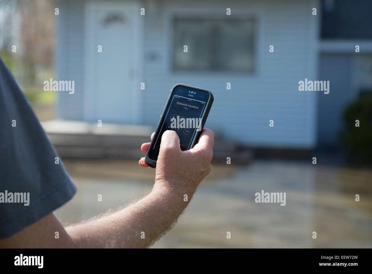 Man using smartphone during flood Stock Photo - Alamy