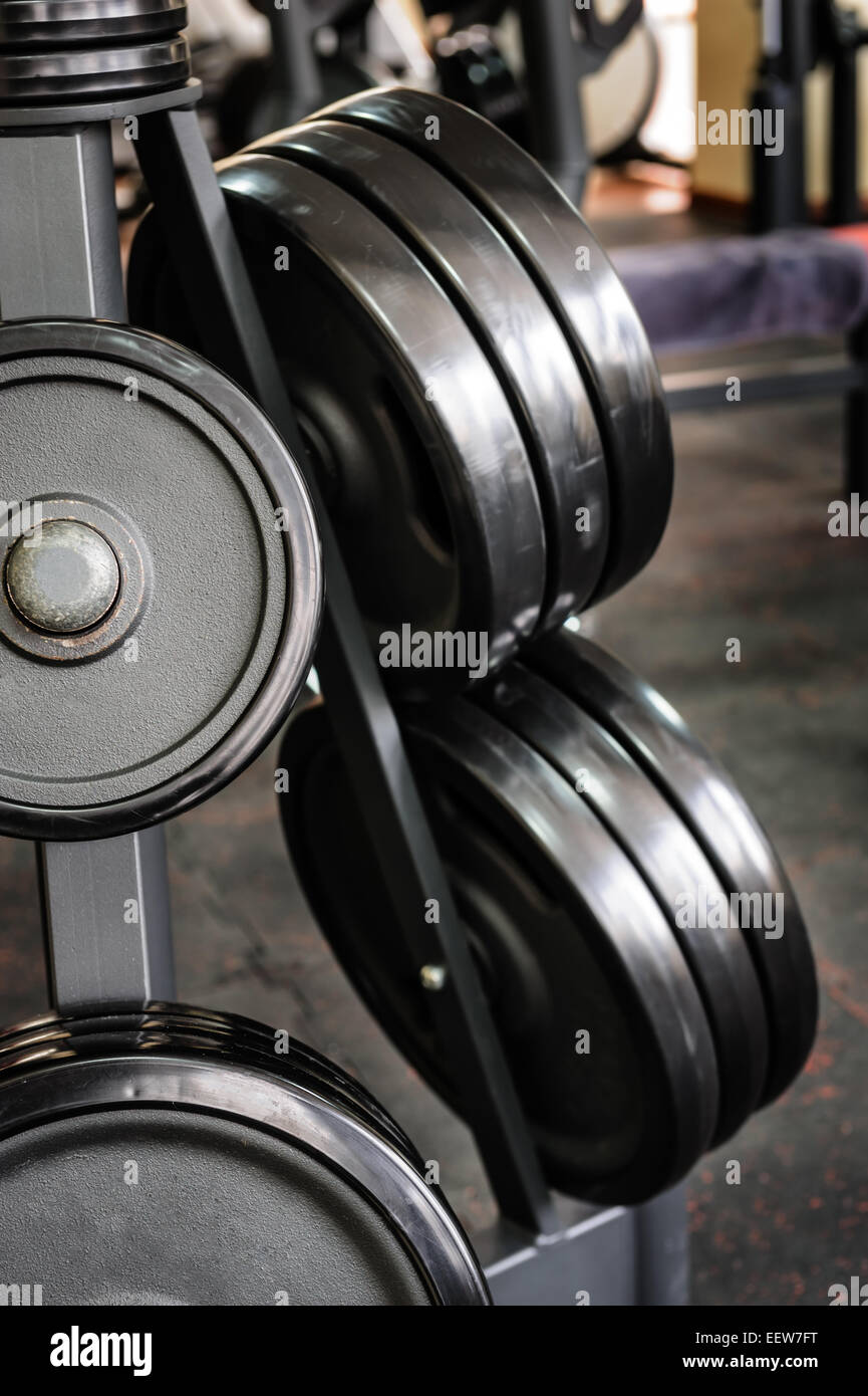 Barbell plates rack Stock Photo - Alamy