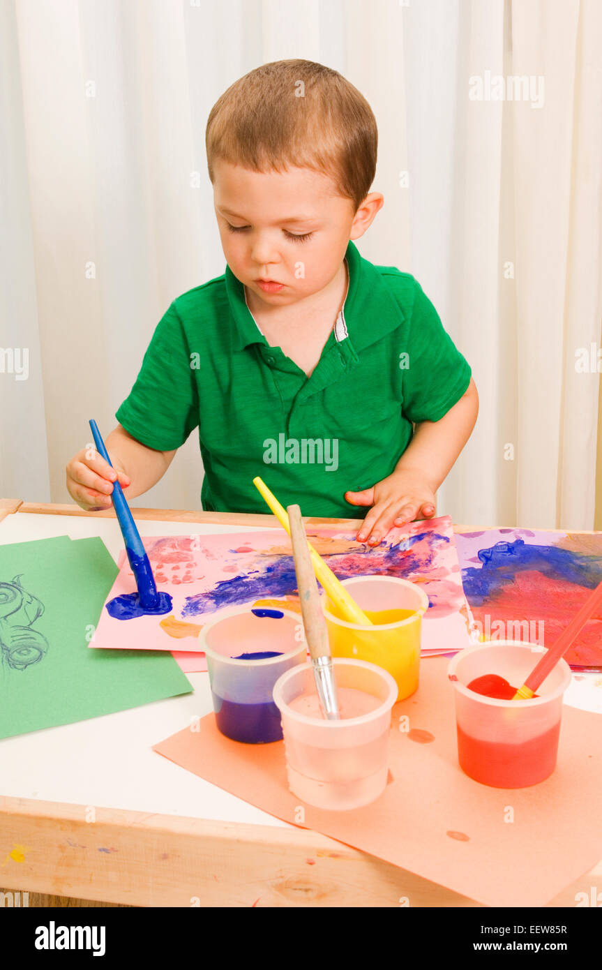 Young boy painting Stock Photo - Alamy Young boy painting Stock Photo - Alamy