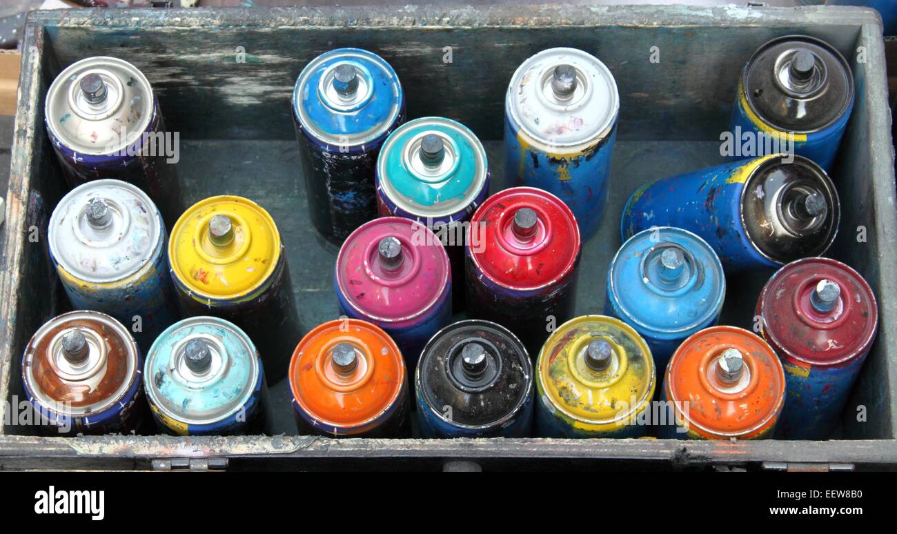 Box with color spray cans used by an artist Stock Photo - Alamy