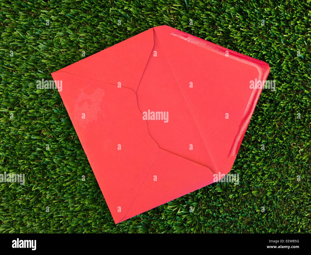 A close up shot of an envelope on artificial grass Stock Photo - Alamy