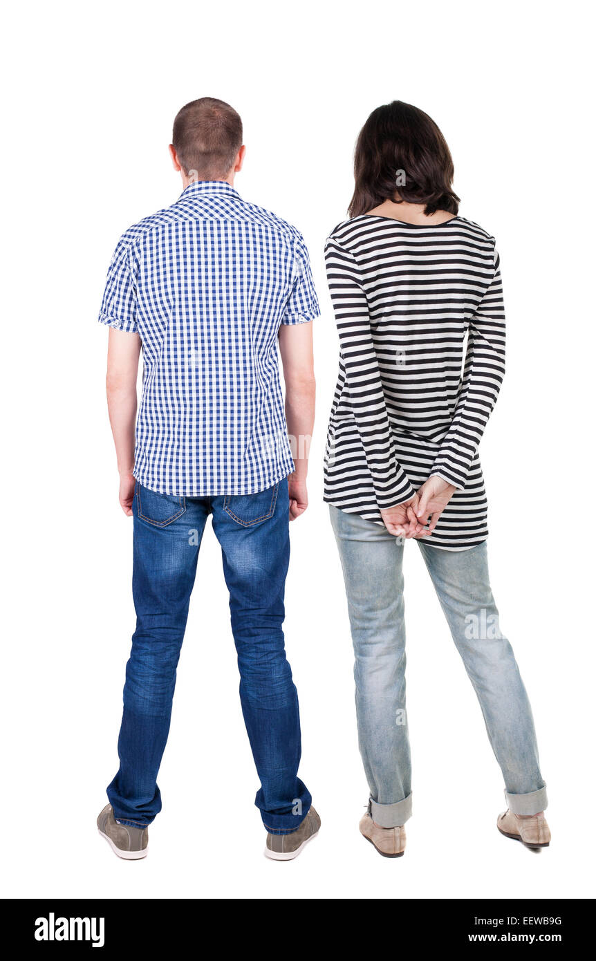 Back view of young couple hug and look into the distance. beautiful ...