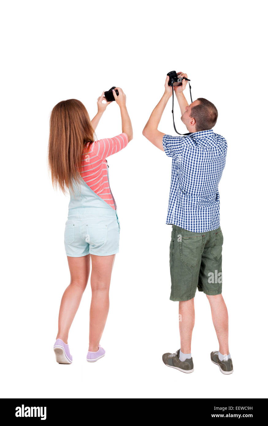 Back view group of people photographed attractions. Rear view team ...