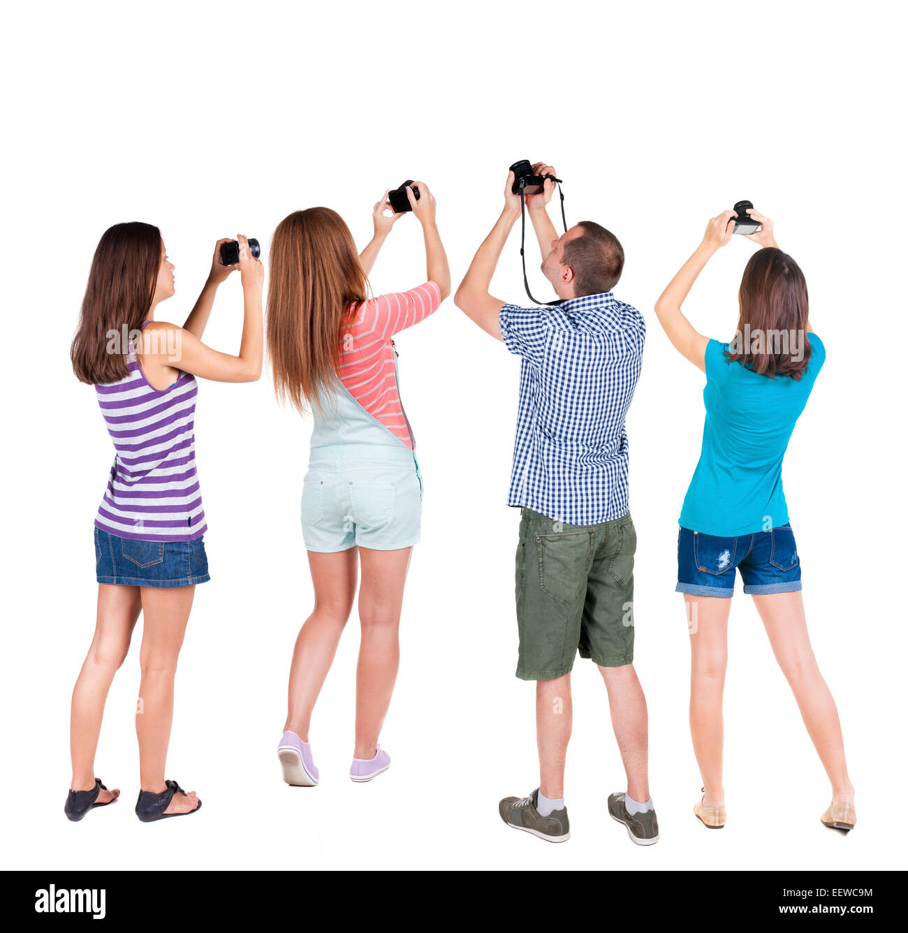 Back view group of people photographed attractions. Rear view team ...