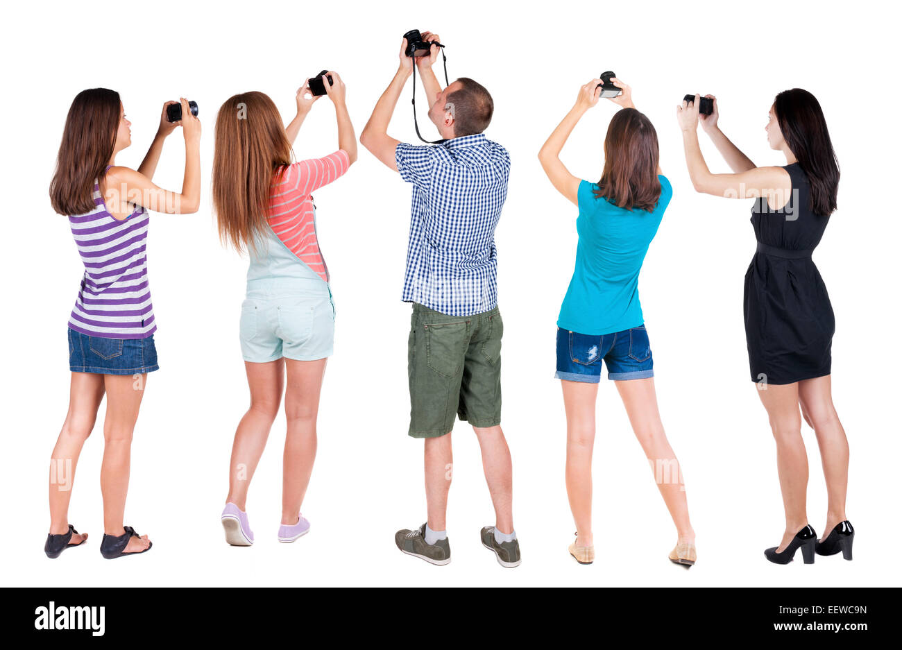 Back view group of people photographed attractions. Rear view team ...