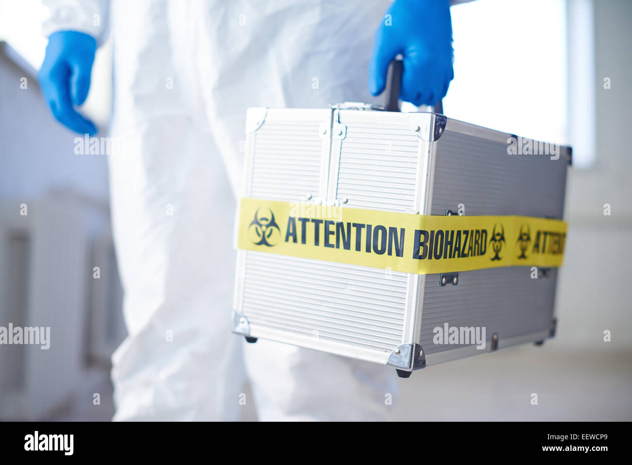Medical case with biohazard held by gloved scientist Stock Photo - Alamy