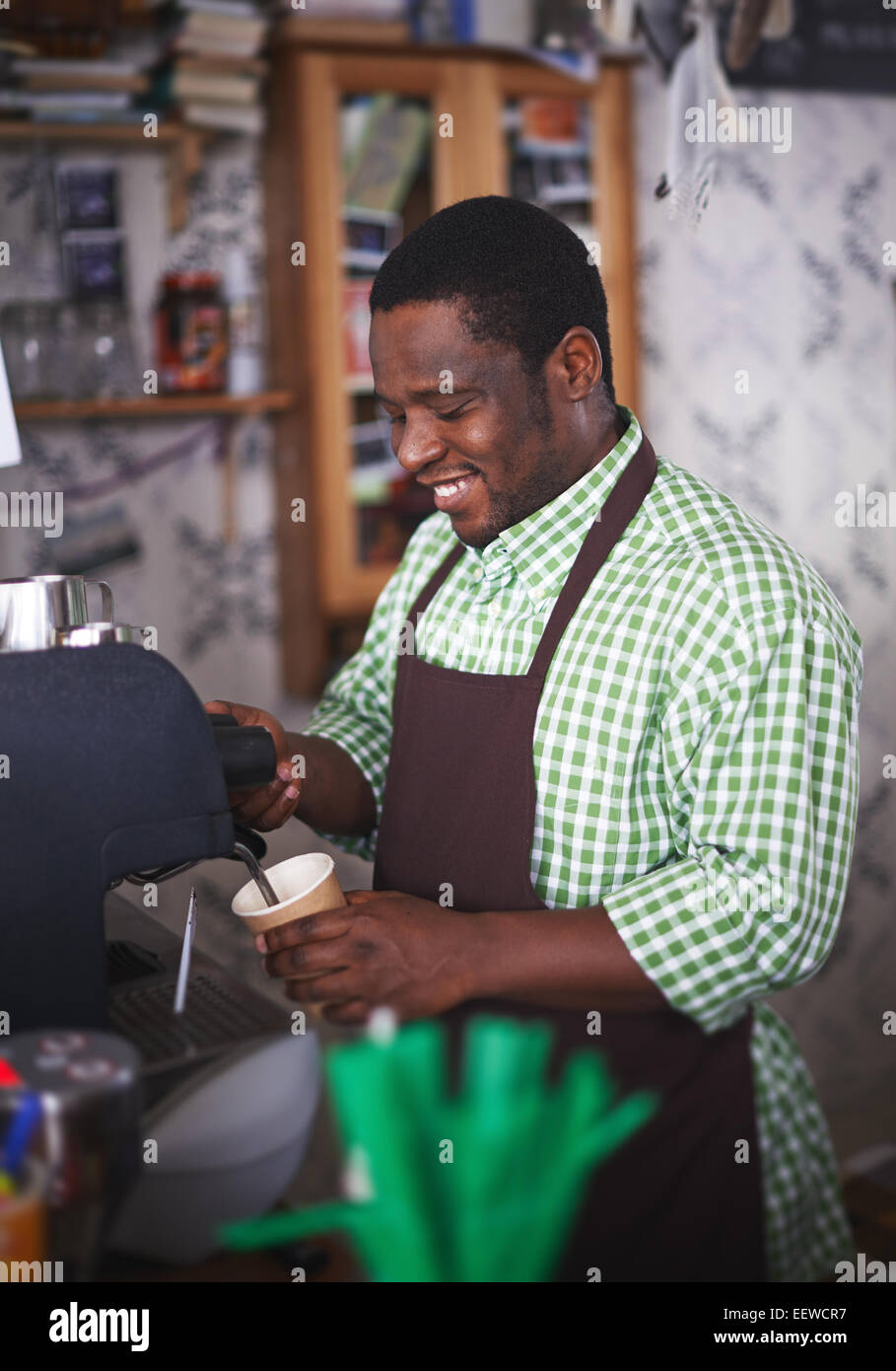 Happy African-american coffee vendor Stock Photo - Alamy